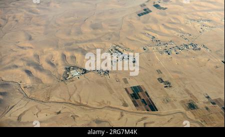 Aerial view of the Jordanian desert with small agricultural farms in ...