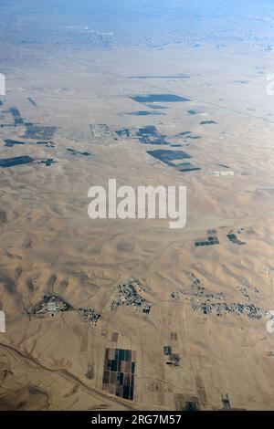 Aerial view of the Jordanian desert with small agricultural farms in ...
