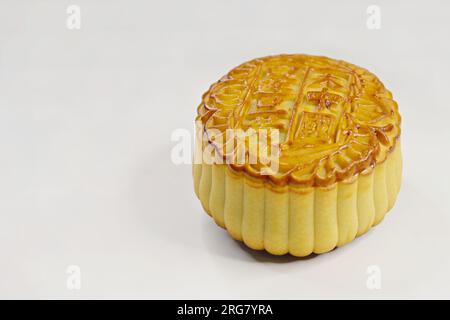 A Chinese mooncake, a round pastry about 4inch in diameter and 1.5inch ...