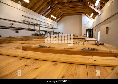 Inside a whisky distillery with vats made of wood in a warehouse Stock ...