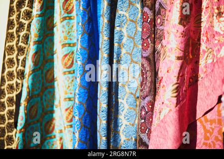 Various colorful carpets and fabrics on traditional Turkish market in ...