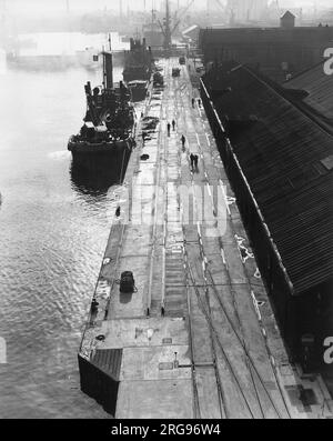Dockside scene with vessels and cranes on the River Thames, Port of ...