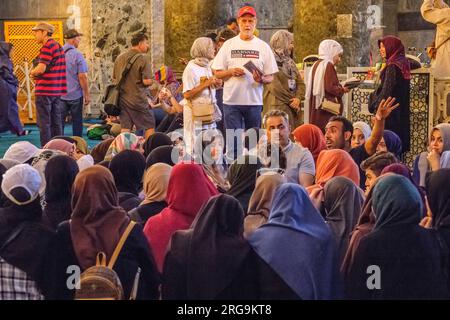 Istanbul, Turkey, Türkiye. Muslim Young Women Listening to Guide inside ...