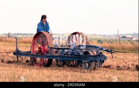 Fowler Ploughing Engine combo with plough in action Stock Photo - Alamy
