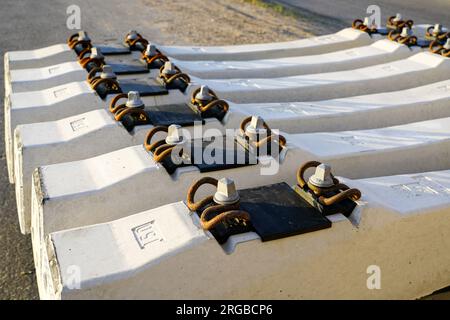 Before installation stacked new reinforced concrete railroad track ...