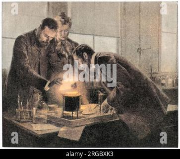 Marie and Pierre Curie in their laboratory in Paris. Illustration from ...