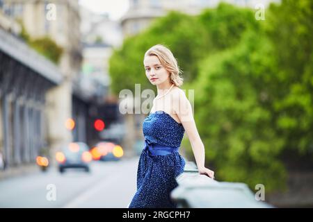 Beautiful young elegant French woman in Paris outdoors Stock Photo - Alamy