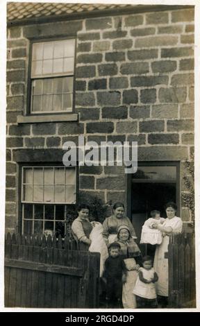 Poor working class women mother, daughters and grand daughter in slum ...
