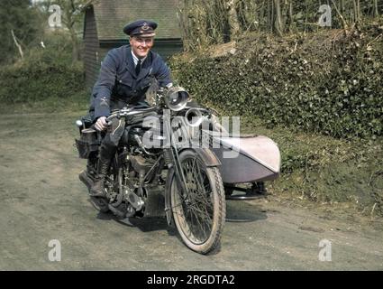 A man in RAF uniform riding a motorbike with a sidecar attached Stock ...