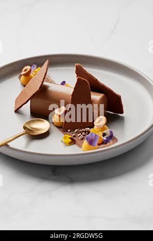 Chocolate mousse, passionfruit curd, candied hazelnuts, cacao nib ...