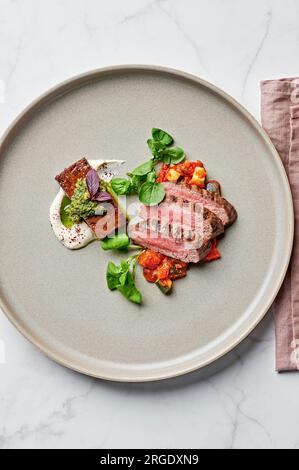 Char-grilled lamb backstrap, pressed lamb shoulder, honey lemon yoghurt ...
