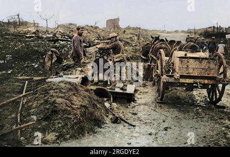 British soldiers drawing water in a captured village on the Western ...