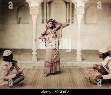 Nautch woman dancing, with two musicians playing, India. Date: circa ...