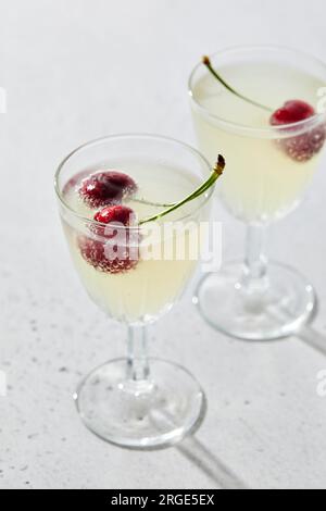 Lemon sparkling water with cherries Stock Photo - Alamy