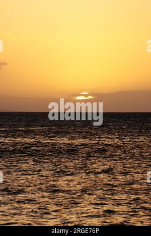 Melting Sun - Maui Sunset Stock Photo - Alamy