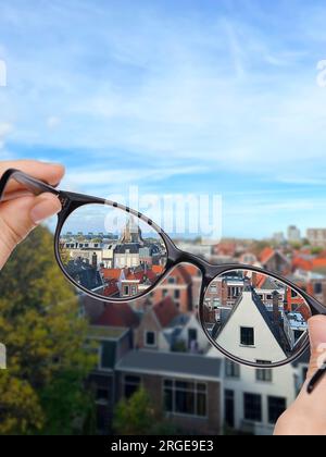 Vision correction. Woman looking through glasses and seeing forest ...