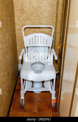 Commode chair with wheels, shower and toilet for elderly and/or ...