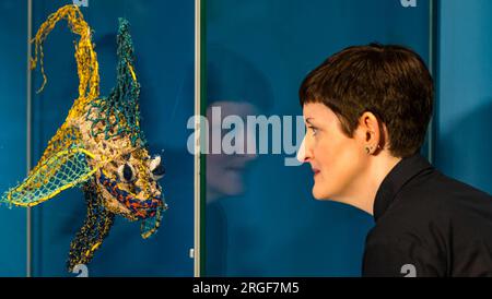 Dr Ali Clark curator of exhibition Rising Tide with plastic art ...