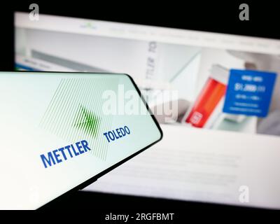 Logo of public company Mettler Toledo displayed on a smartphone. Grey ...