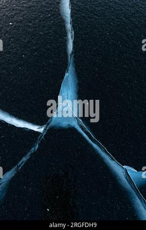 Deep Blue cracked ice winter season surface Stock Photo - Alamy
