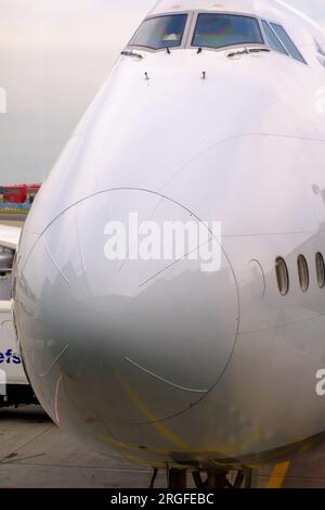 View of the nose and cockpit window of a Boeing 747 at the airport of ...