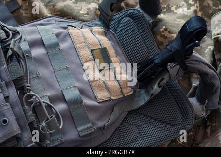 Mil grey bulletproof vest with banner of ukrainian flag and pixel ...