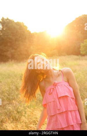 Young woman tossing her hair Stock Photo - Alamy