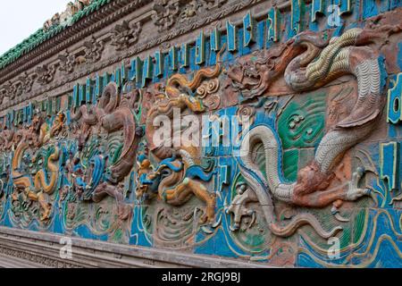 A part of the Nine Dragon Wall in Beihai Park, Beijing, China Stock ...