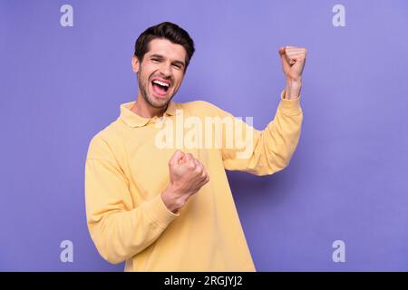 Photo of delighted overjoyed person raise fists luck accomplishment ...