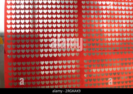 Small colorful paper foil hearts on white background. Decorative foil ...