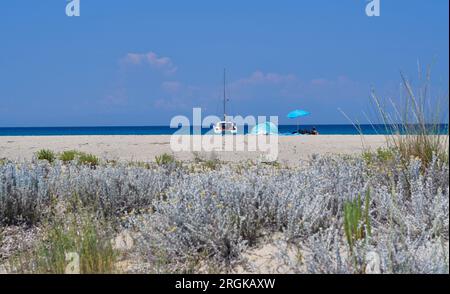 Greece, Halkidiki, sailing catamaran at Possidi cape with sandy beach ...