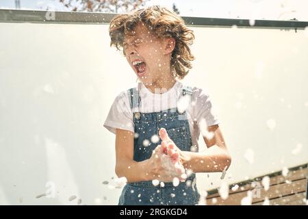 happy boy shaking his hair Stock Photo - Alamy