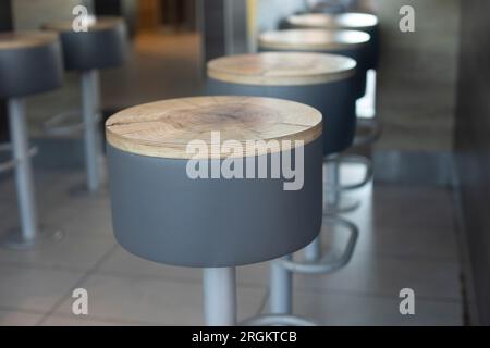 Round seat. Seating for visitors. Empty space. Bar Stock Photo - Alamy