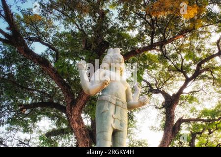 Four-armed multi-faced Hindu deity, sculpted in Cambodia Stock Photo ...
