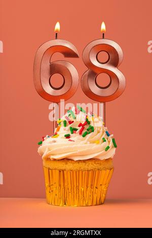 Candle number 68 - Cake birthday in rhodamine red background Stock ...