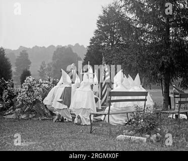 Members of the Ku Klux Klan attending a funeral ca. 1923 Stock Photo ...