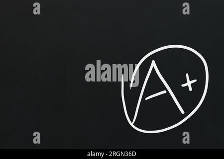 School grade. Chalked letter A with plus symbol on blackboard Stock ...