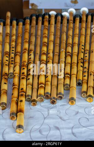 Dozens of handmade wooden flutes in display Stock Photo - Alamy