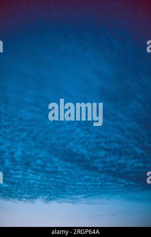 Gray color clouds partly cover the sky Stock Photo - Alamy