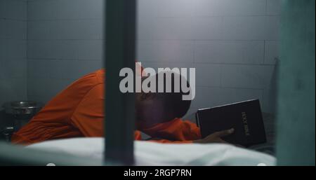 african american prisoner holding book and looking at camera Stock ...