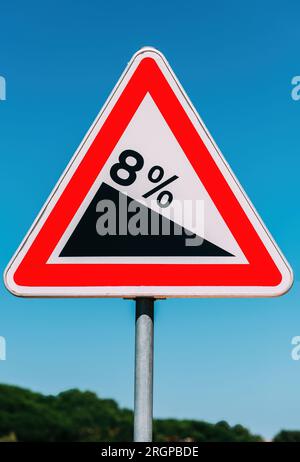 Steep Grade Warning Sign: Drivers are warned of a steep downhill drive ...