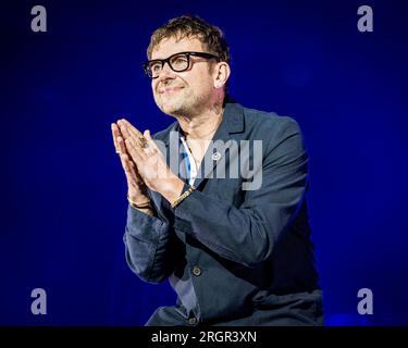 Lead singer of Blur, Damon Albarn with a joint behind his ear during a ...
