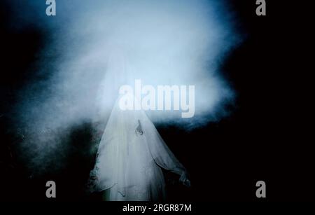 scary ghost in foggy night Halloween background Stock Photo - Alamy