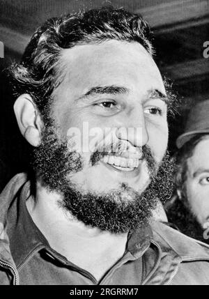 Cuban Prime Minister Fidel Castro holds his hand to his head as he ...