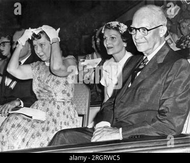 President Dwight Eisenhower and Mrs. Mamie Eisenhower are shown leaving ...