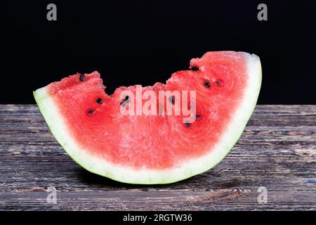 Large red raw watermelon pieces on gray background. It sweet, juicy ...