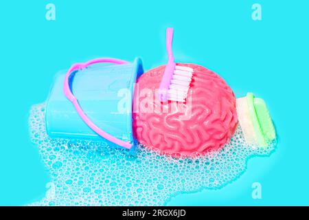 Human brain model accompanied by a set of miniature hand tools like a ...