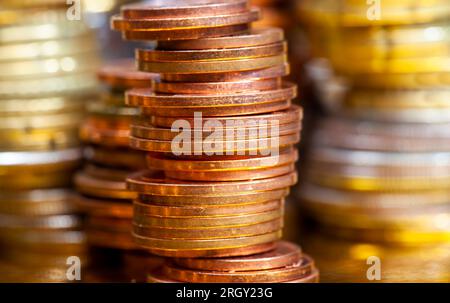 a large number of coins lying together, metal coins of different ...
