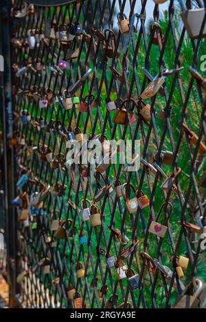 Love padlocks on fence, sea in Greece Stock Photo - Alamy