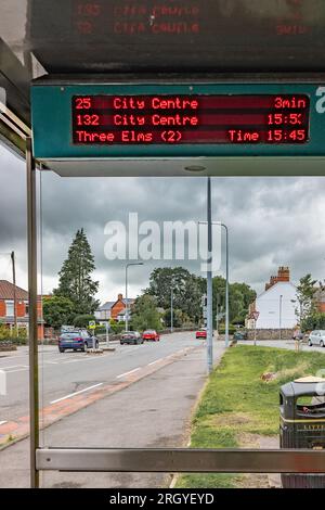 Cardiff, Wales, UK - Bus timetable showing the next buses at a bus stop ...